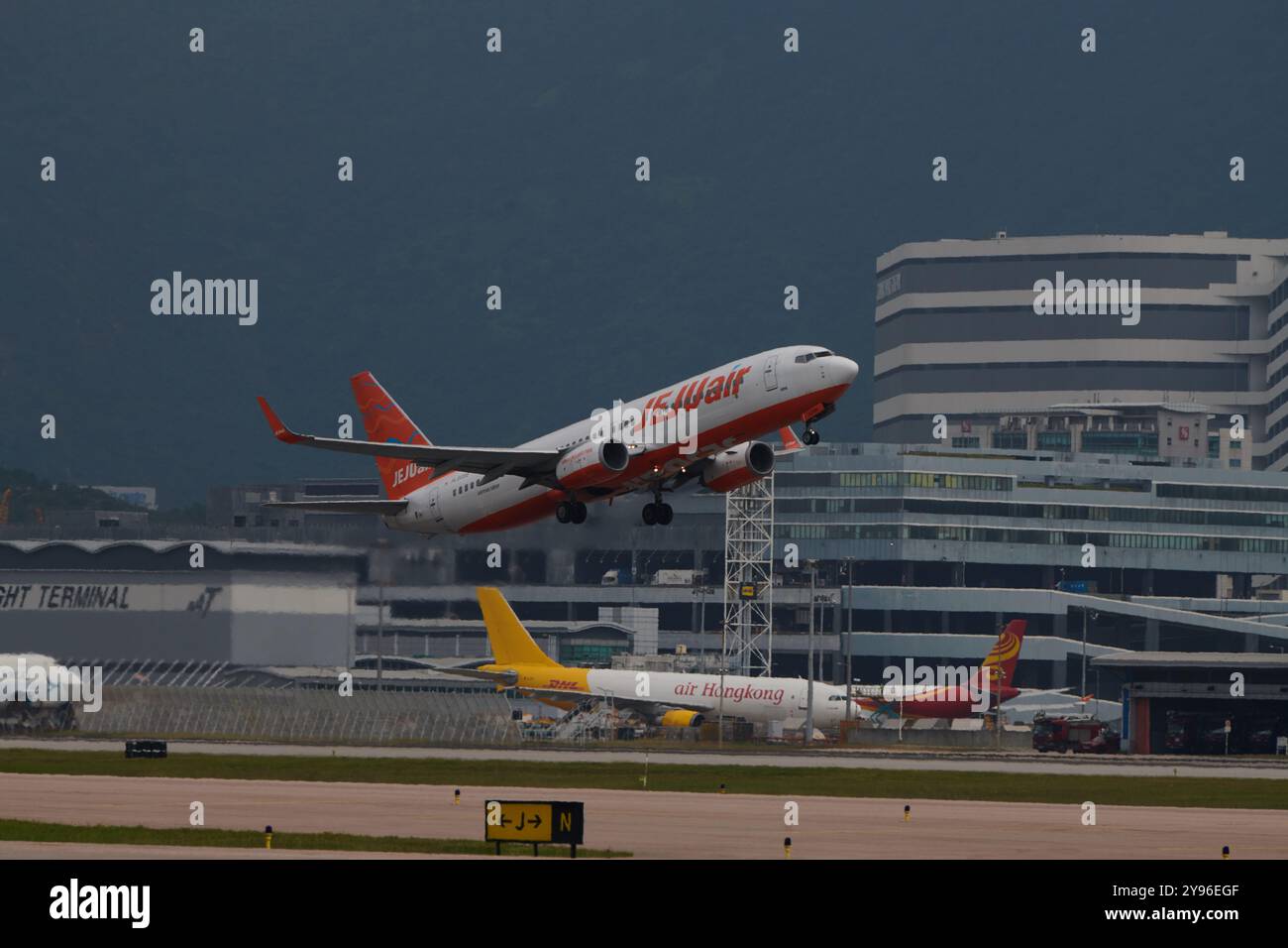 A Jejuair passenger jet taking off from Hong Kong International Airport ...
