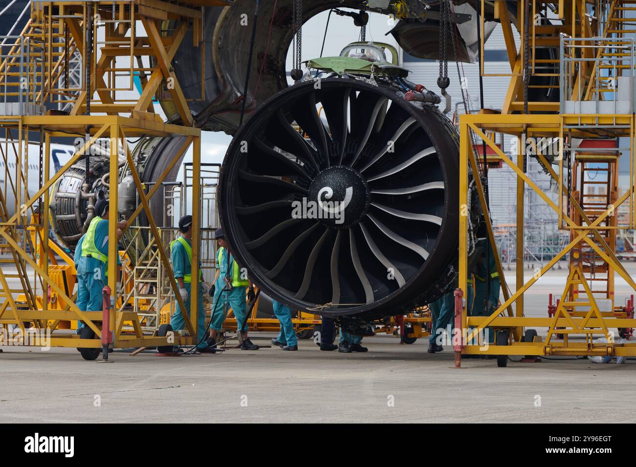 Engineers repairing an Airbus A350 passenger jet engine after reported ...