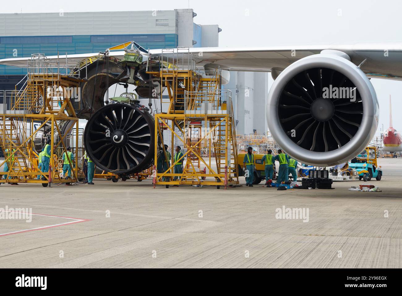 Engineers repairing an Airbus A350 passenger jet engine after reported ...