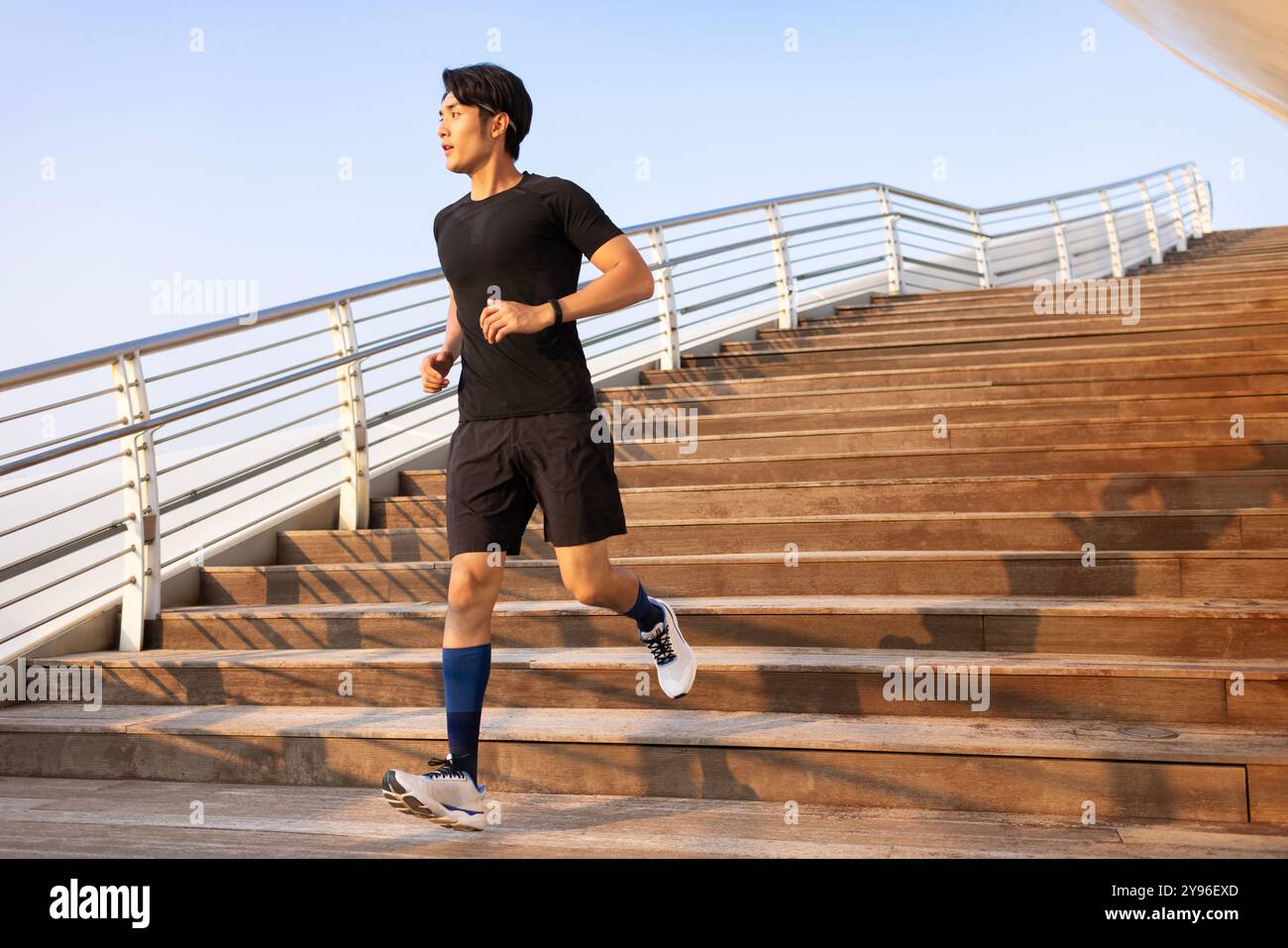 Young man running on the steps Stock Photo - Alamy