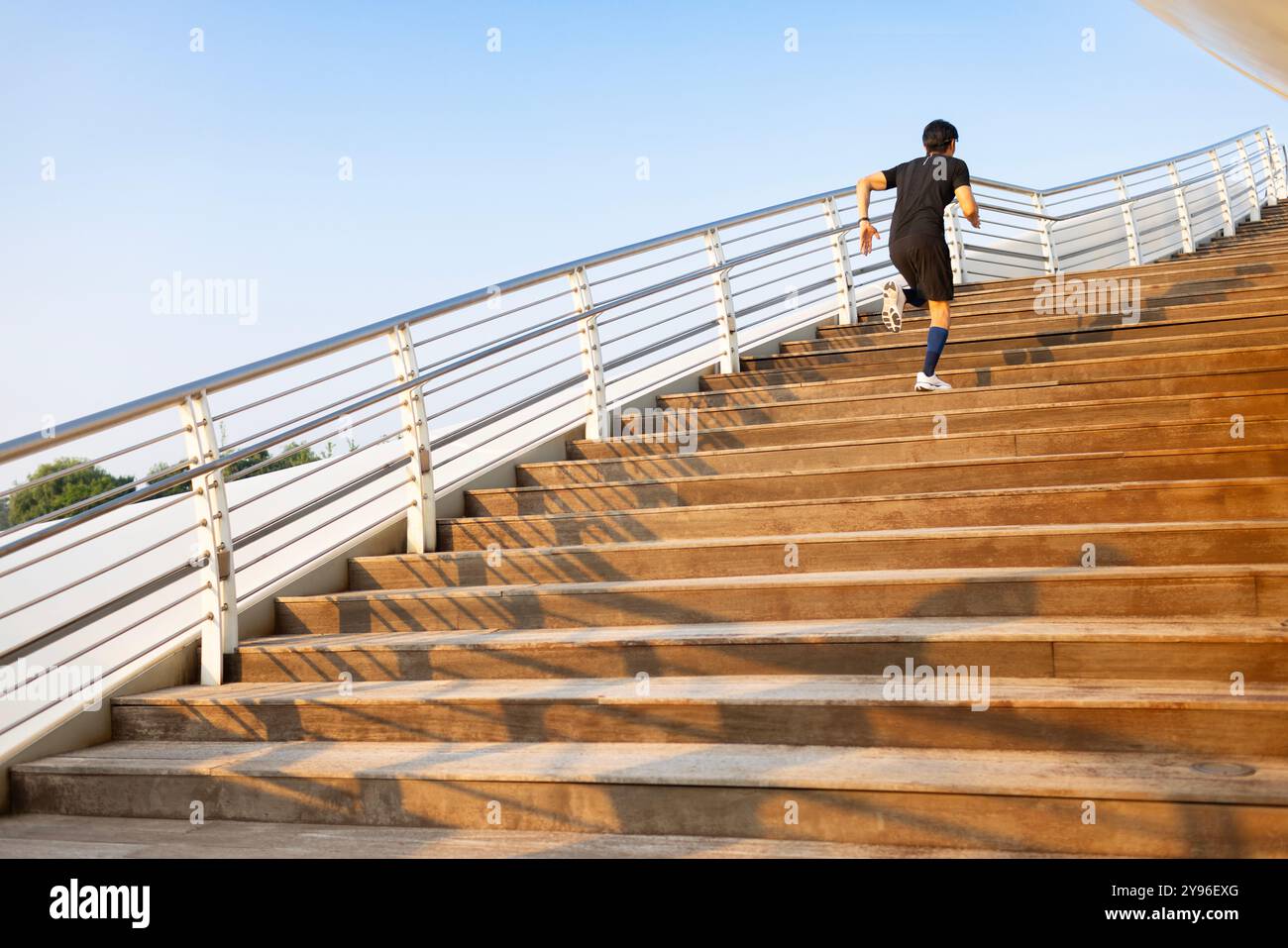 Young man running on the steps Stock Photo - Alamy