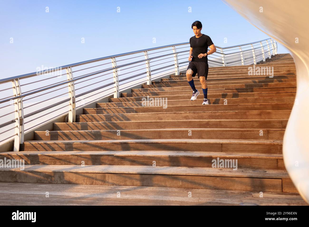 Young man running on the steps Stock Photo - Alamy