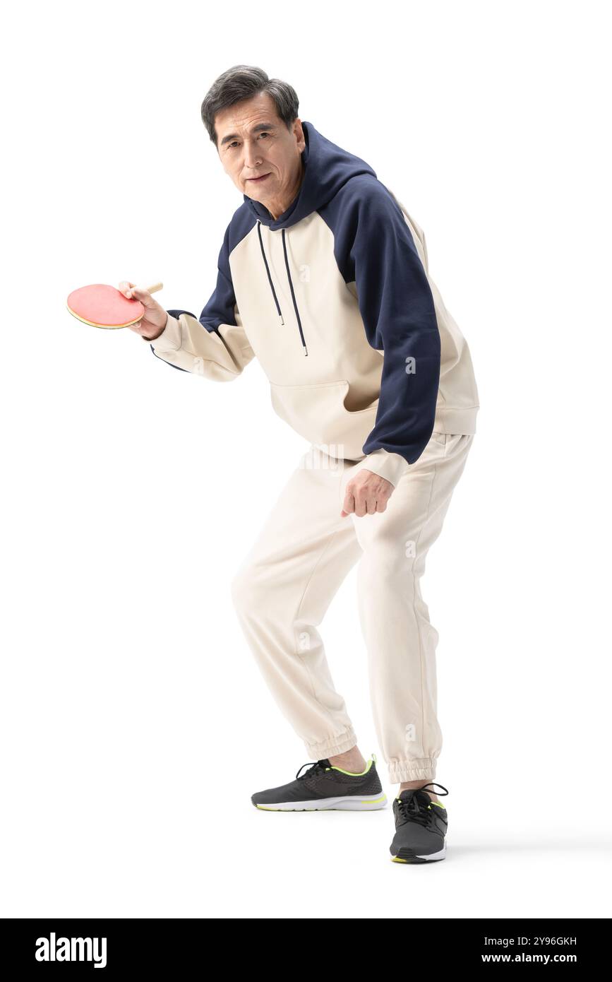 Happy senior man playing table tennis Stock Photo - Alamy