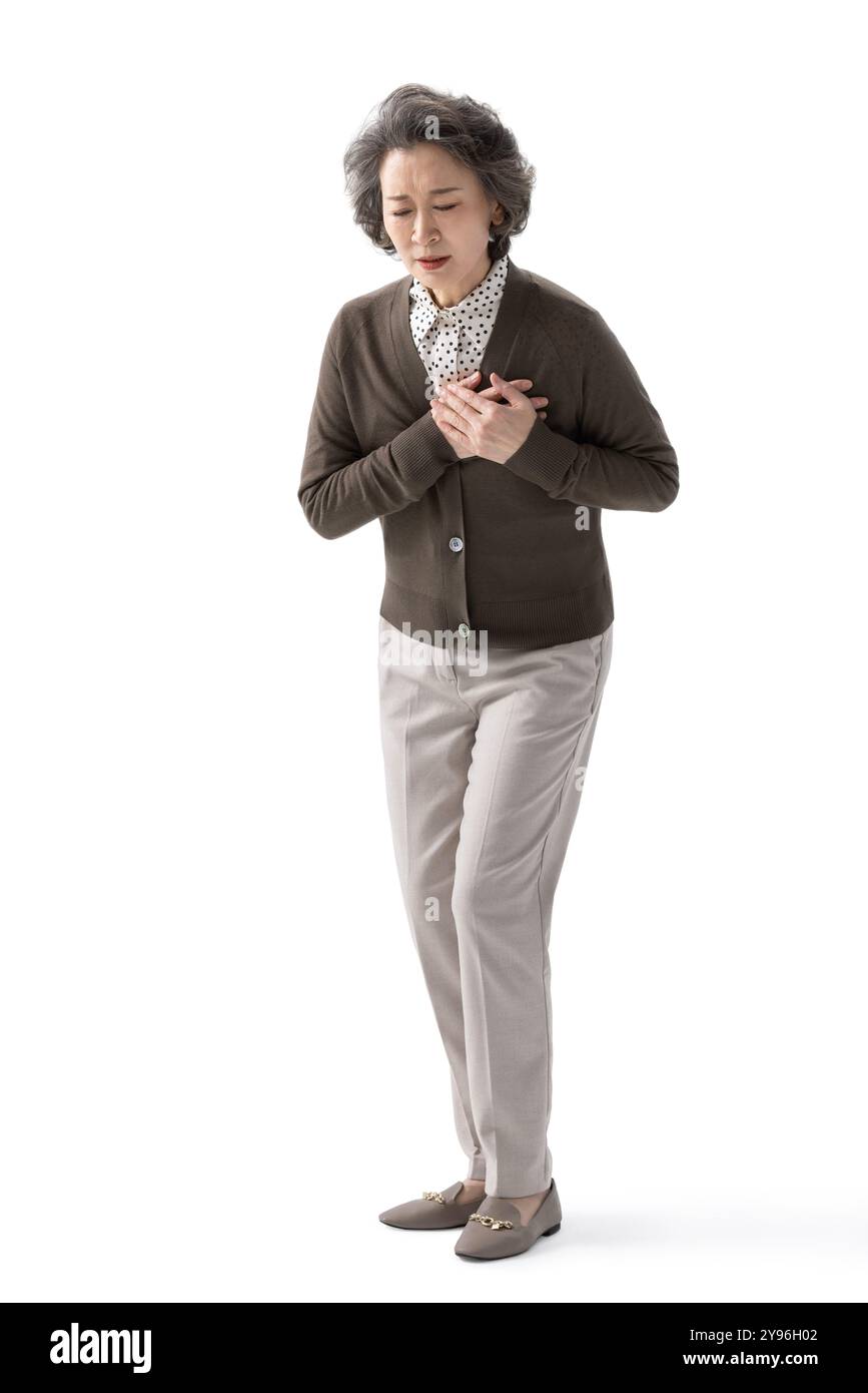 Woman hands on chest eyes closed Cut Out Stock Images & Pictures - Alamy