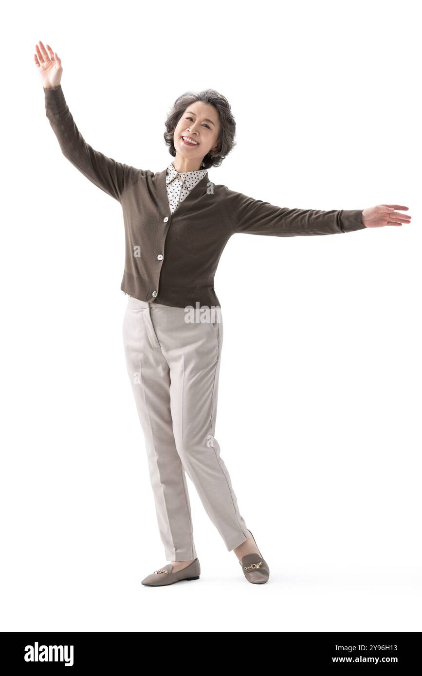 Happy senior woman dancing Stock Photo - Alamy