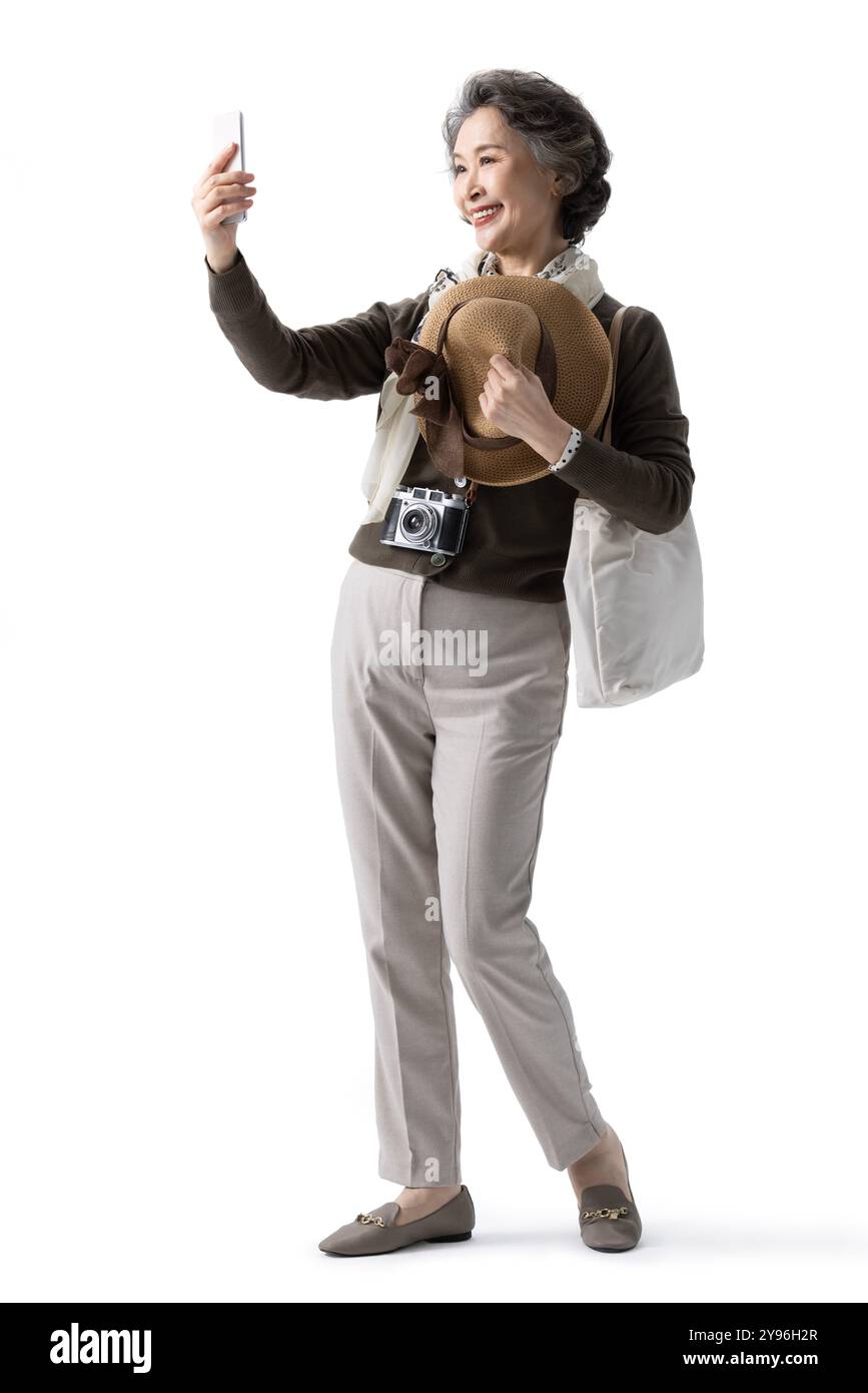 Senior woman taking a trip Stock Photo - Alamy