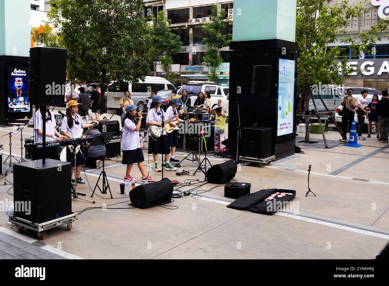 Music band of thai student girls group acting musician and dancing to ...