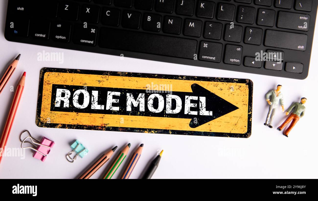 Role Model. Text on yellow arrow. Computer keyboard on the office table ...