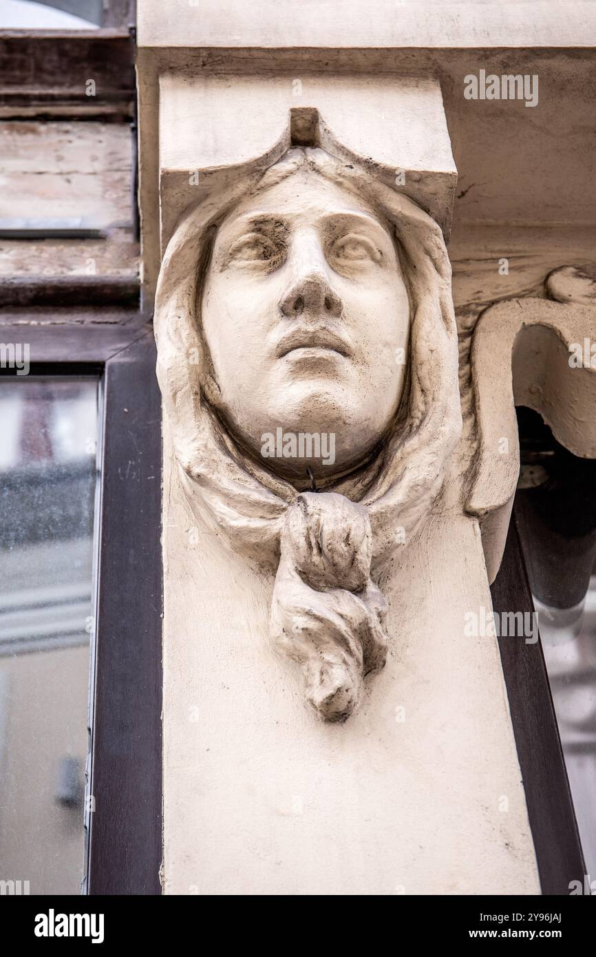 Art Nouveau architectural elements, human head sculpture on the wall of ...