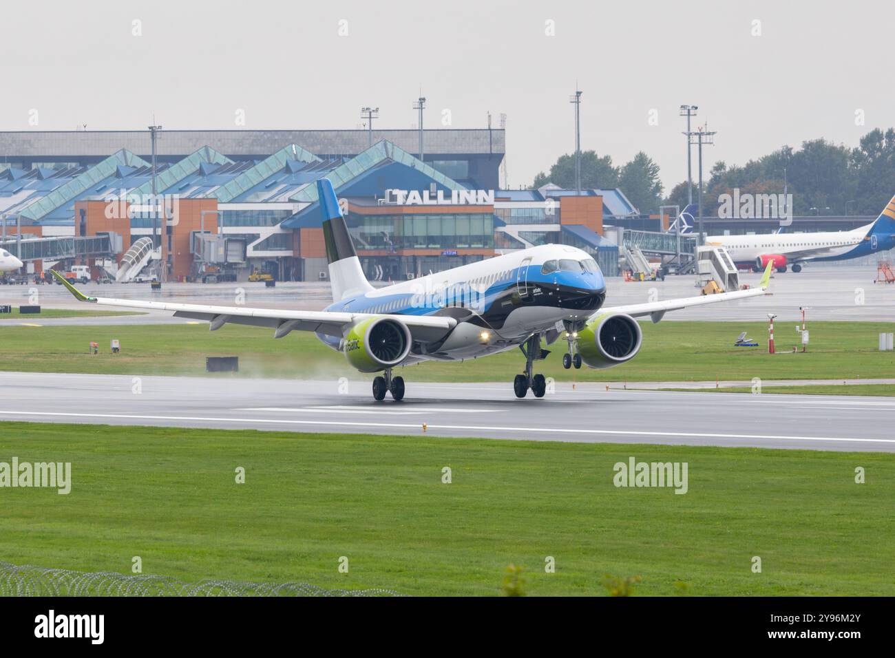 Air Baltic Airbus a220 painted in Estonian flag colours Stock Photo - Alamy