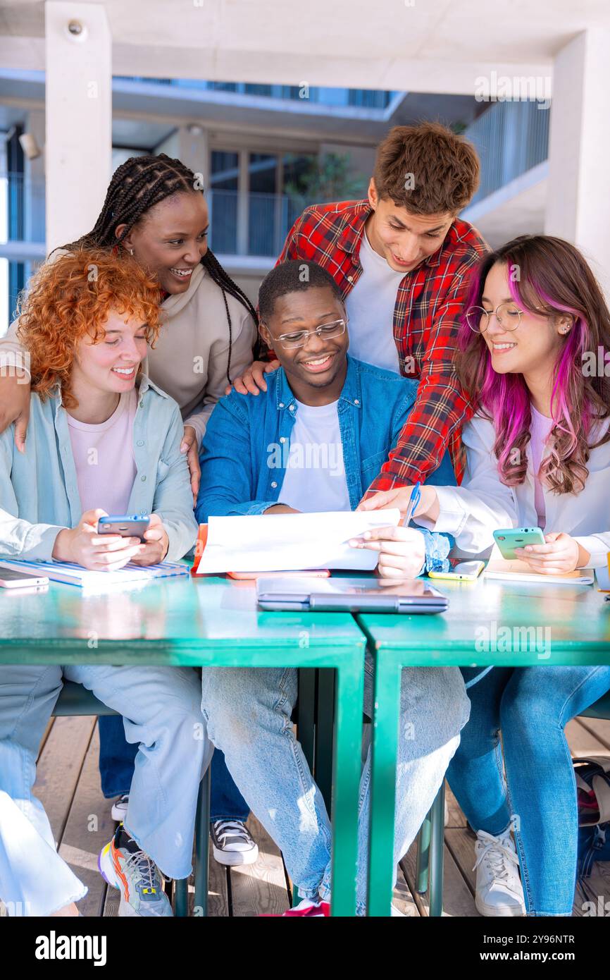 Happy diverse group of students studying in the library.Vertical Stock ...