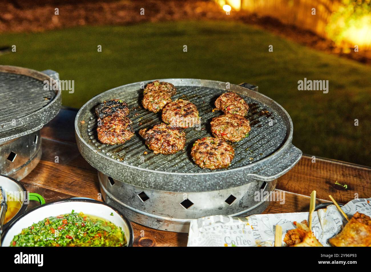 Grilled Beef Patties on Outdoor Iron Grill Stock Photo - Alamy