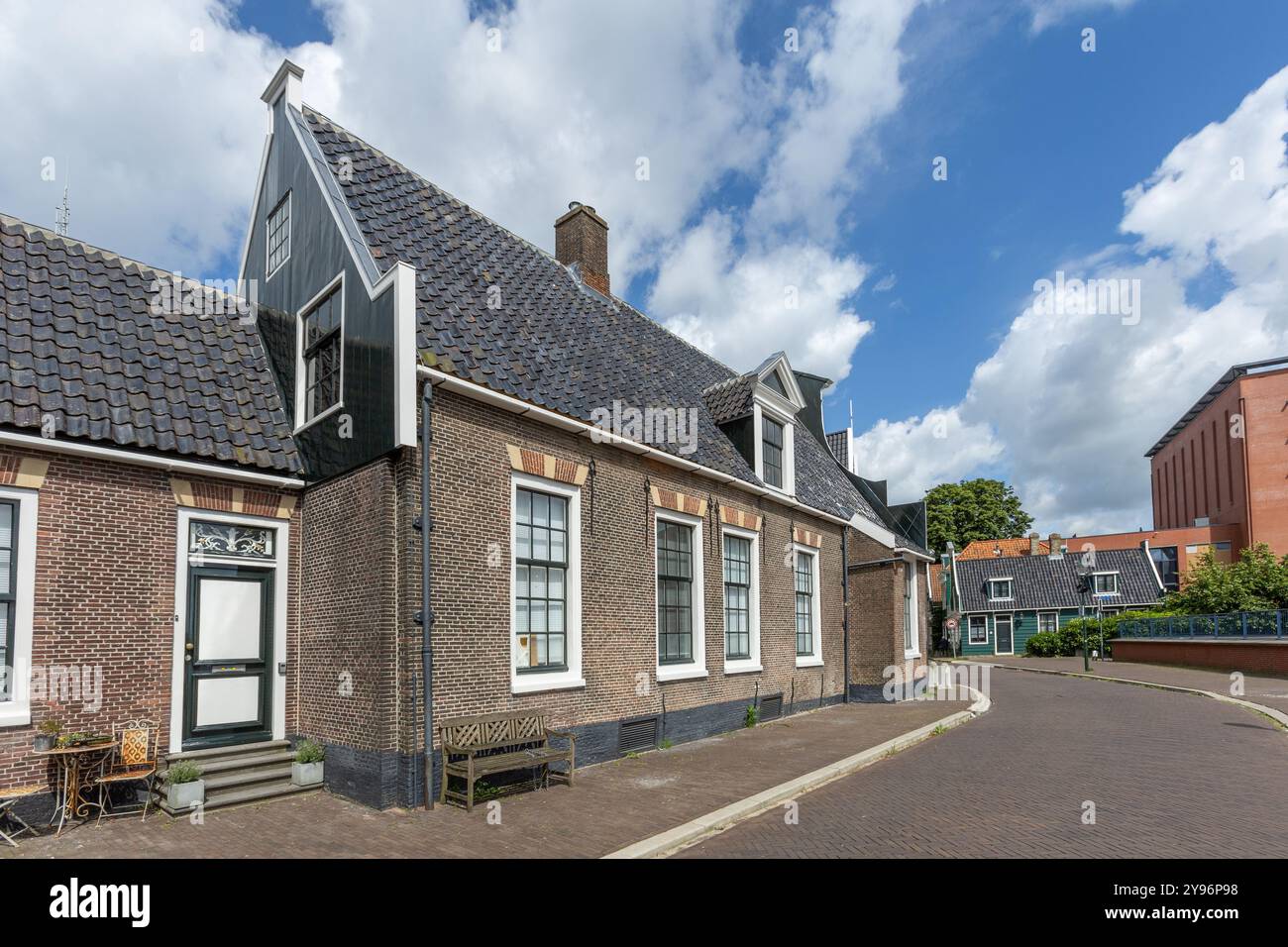 Original and traditional brick house in Zaandam. an empty street ...