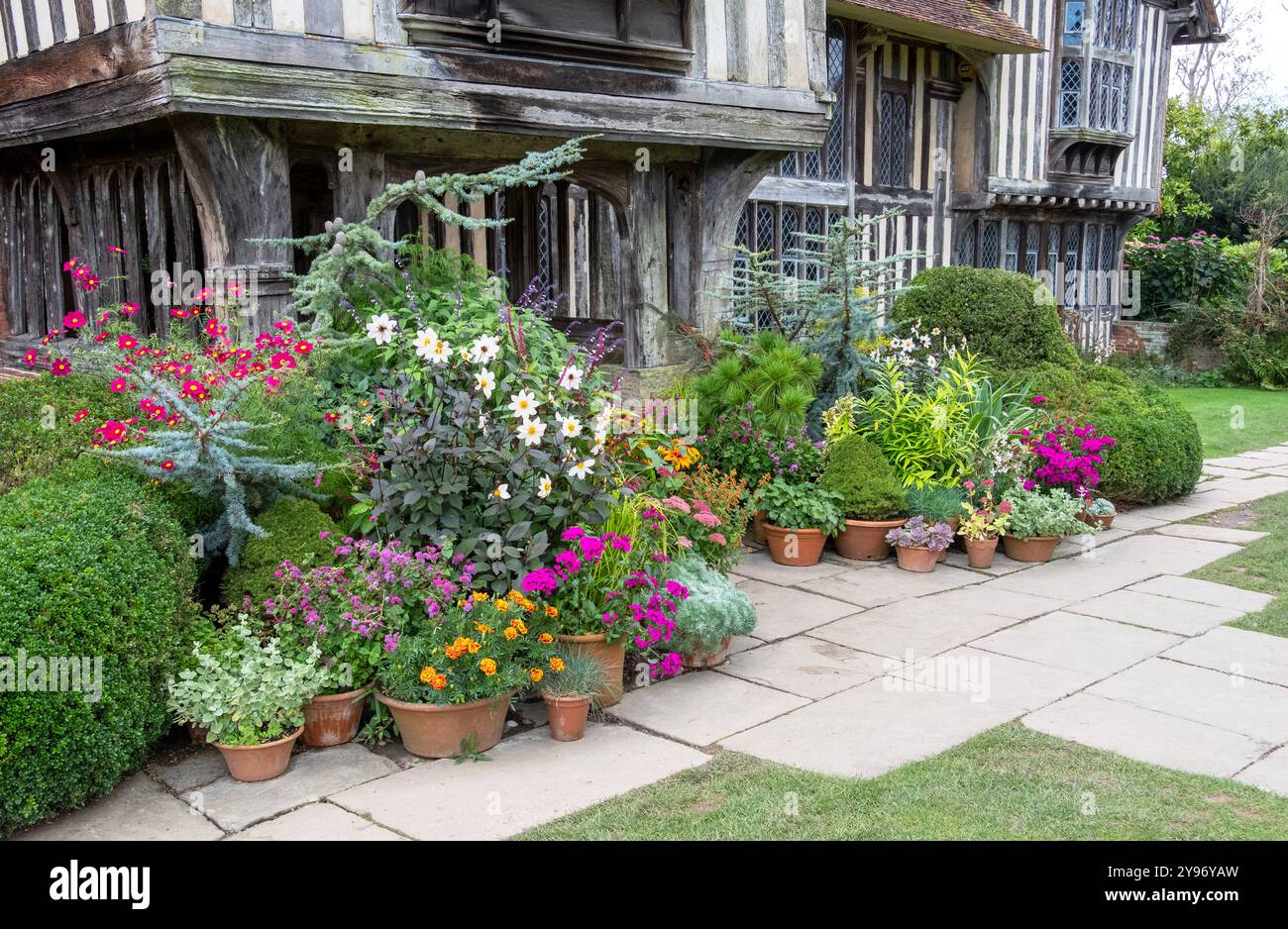 Display of Autumn plant pots at the entrance of Great Dixter House ...