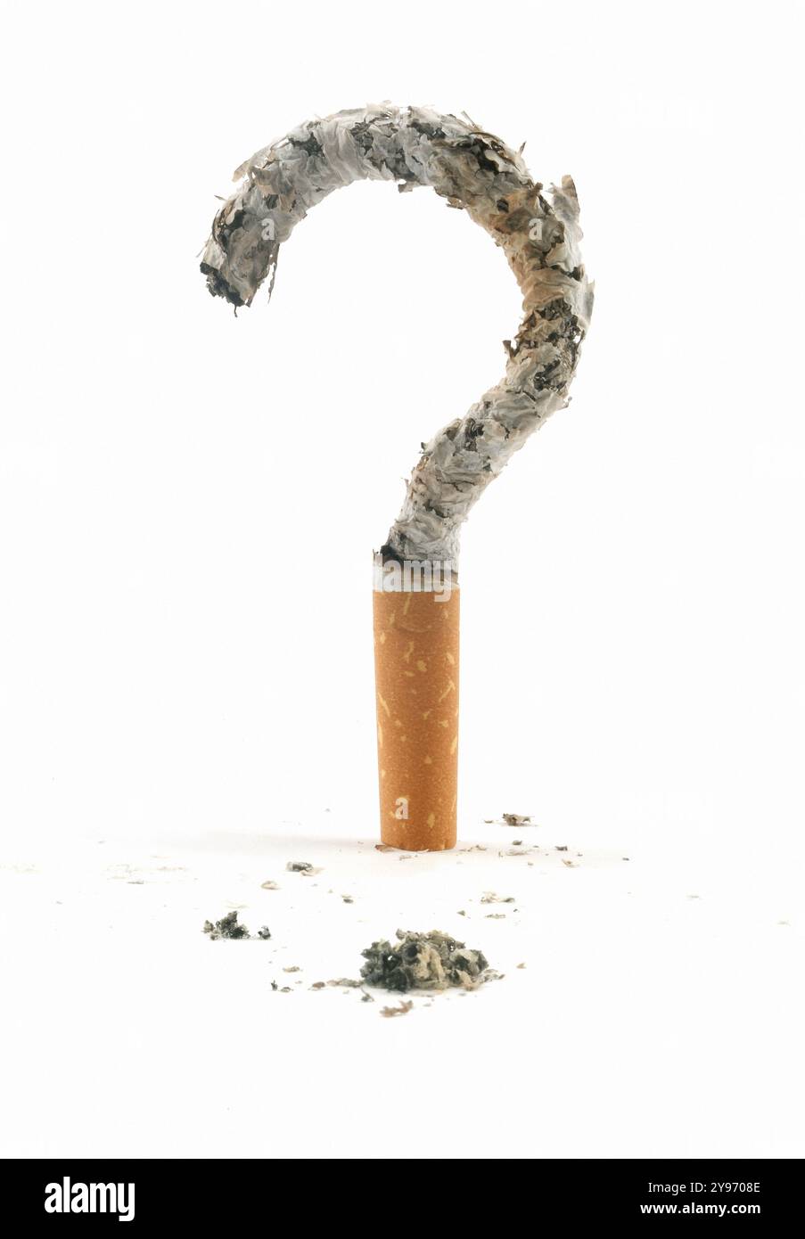 A burnt out cigarette standing on its butt with it's ash formed in to ...