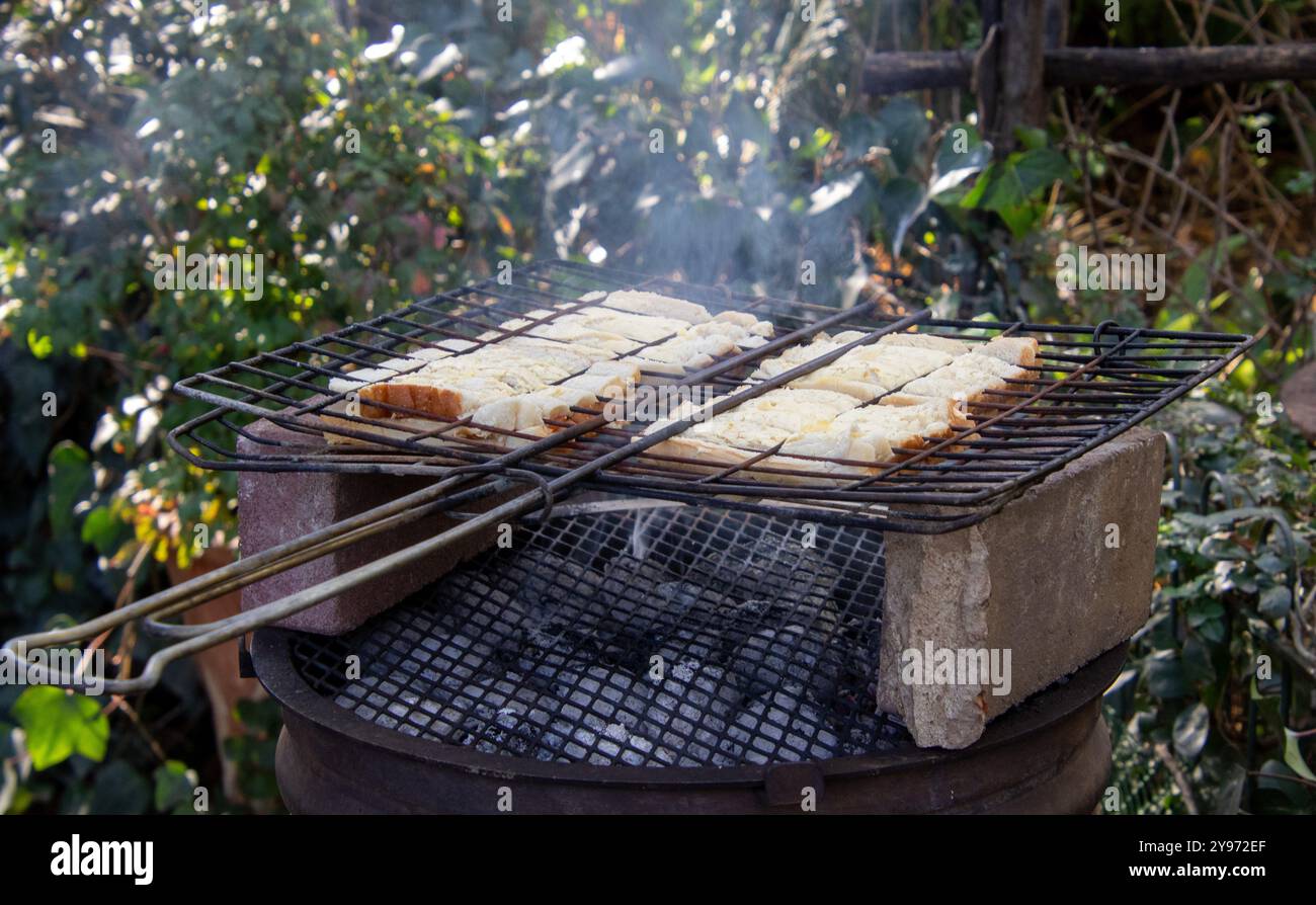 Braai broodjies on a grill in the outdoors is a South African tradition ...