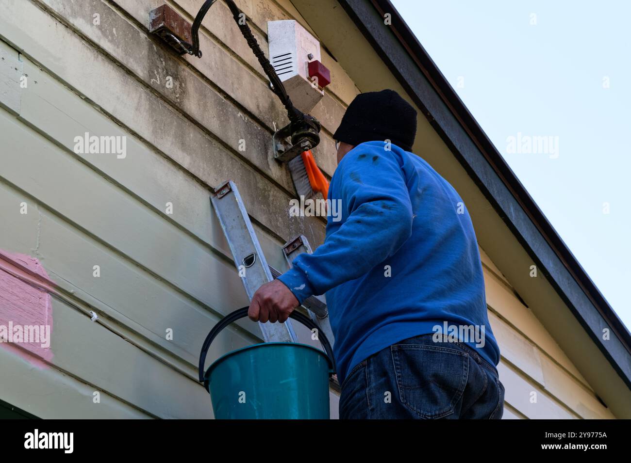 A man is cleaning a house ready for painting. He has had to have the ...