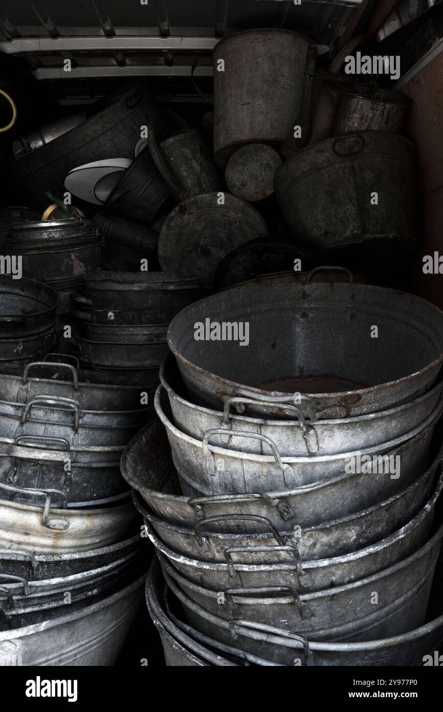 Piles of Galvanized buckets in storage Stock Photo - Alamy
