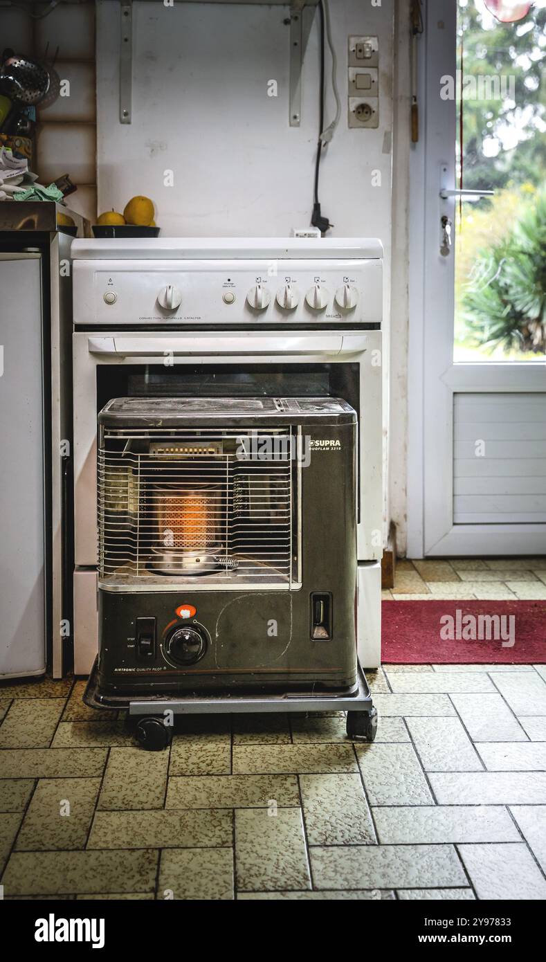 Energy poverty. Supra Duoflam 3310 kerosene extra heater in front of a ...