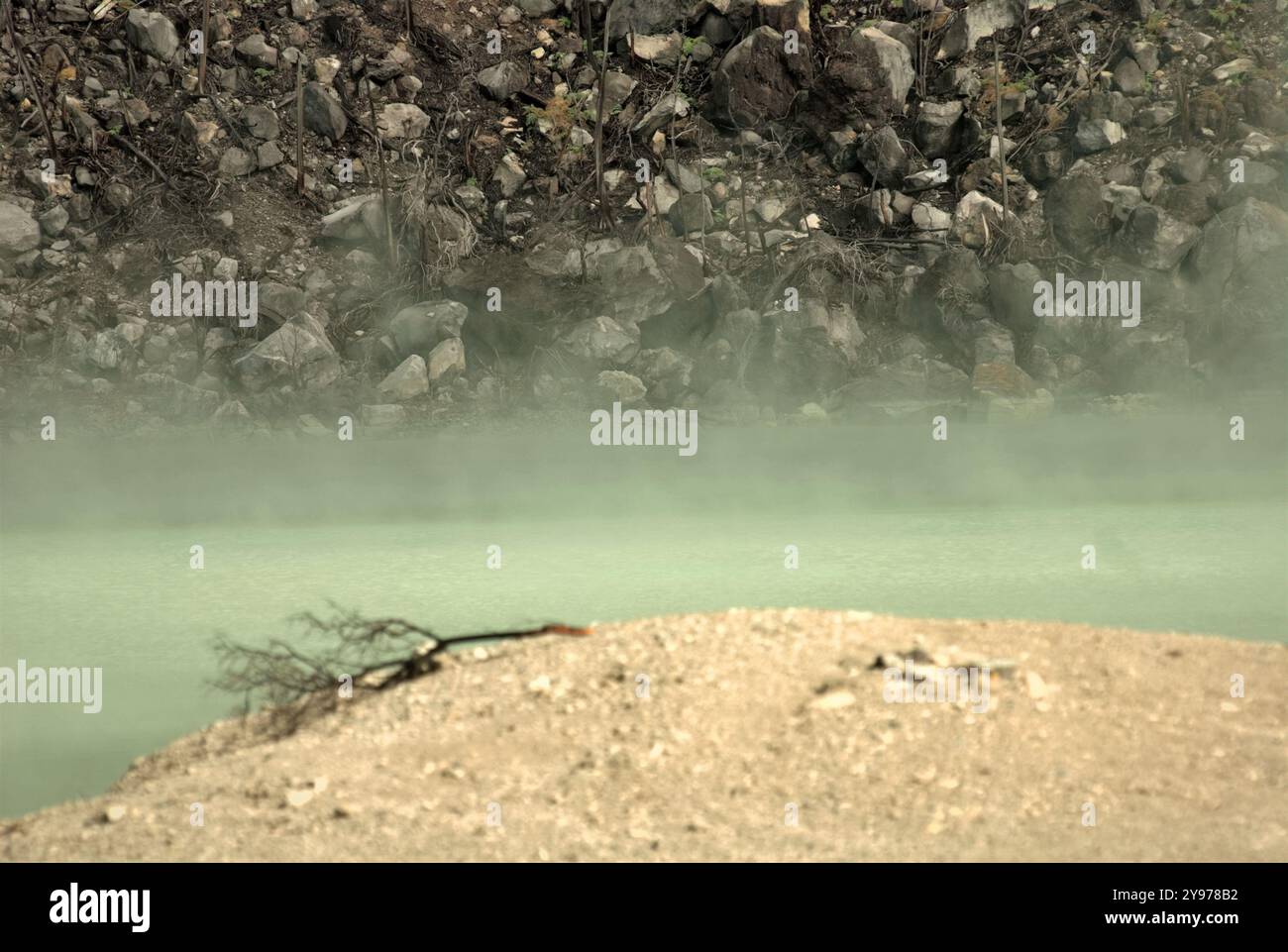 Details of crater wall in a foreground of crater lake and a dead ...