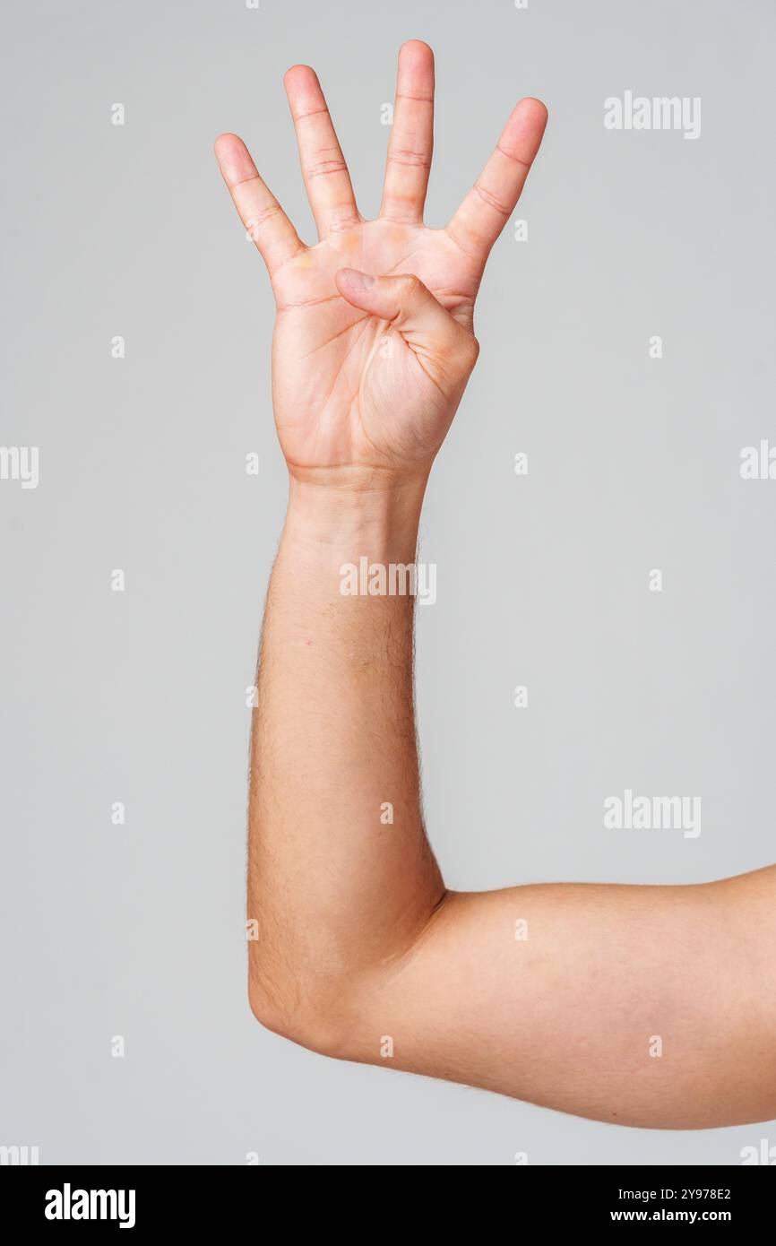 A person hand gesture against a neutral background Stock Photo - Alamy