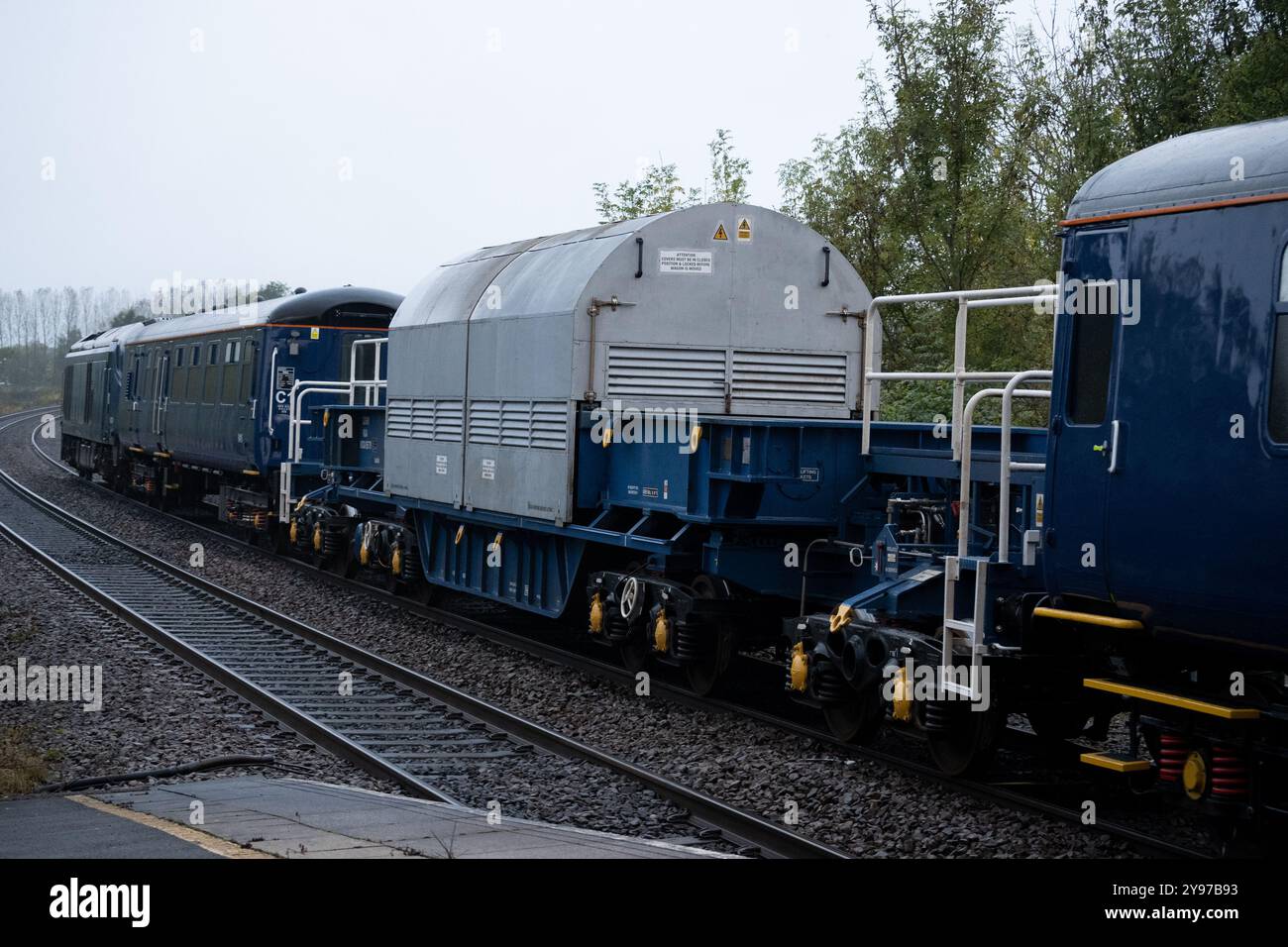 A nuclear flask train passing Warwick Parkway station, Warwickshire, UK ...