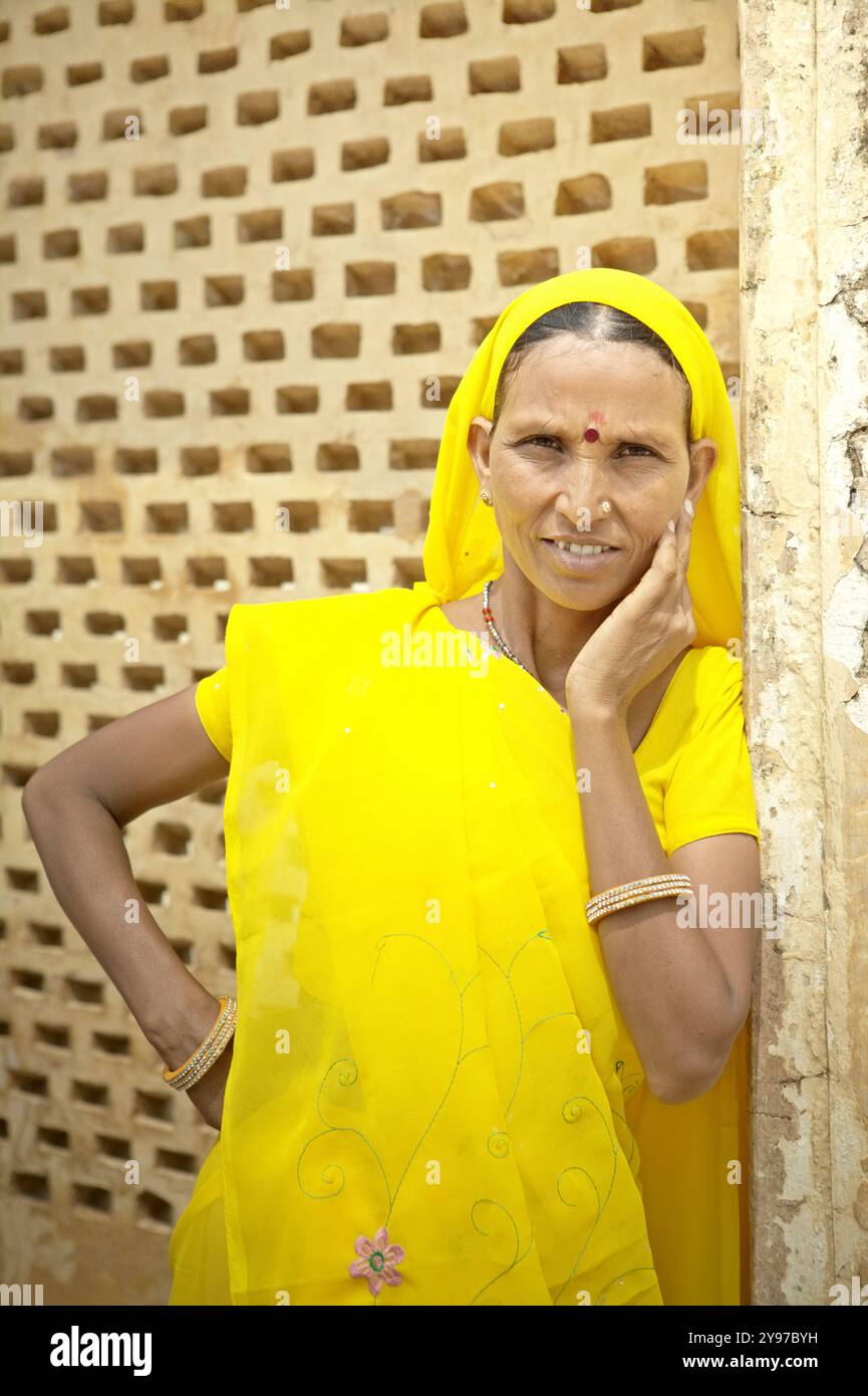 Portrait of a woman, as she is taking a break from work as a janitor at ...