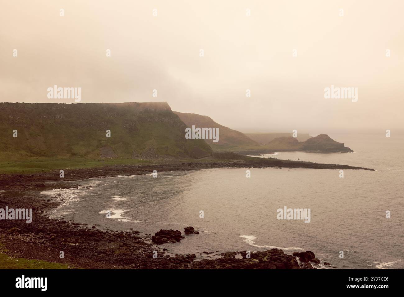 Vintage style coastal scene of Giant's Causeway, Northern Ireland. Dark ...