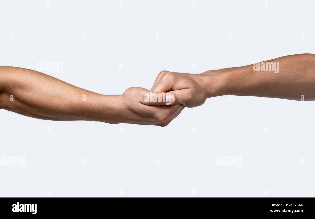 Two hands touching each other on a gray isolated background. Handshake, arms, friendship ...