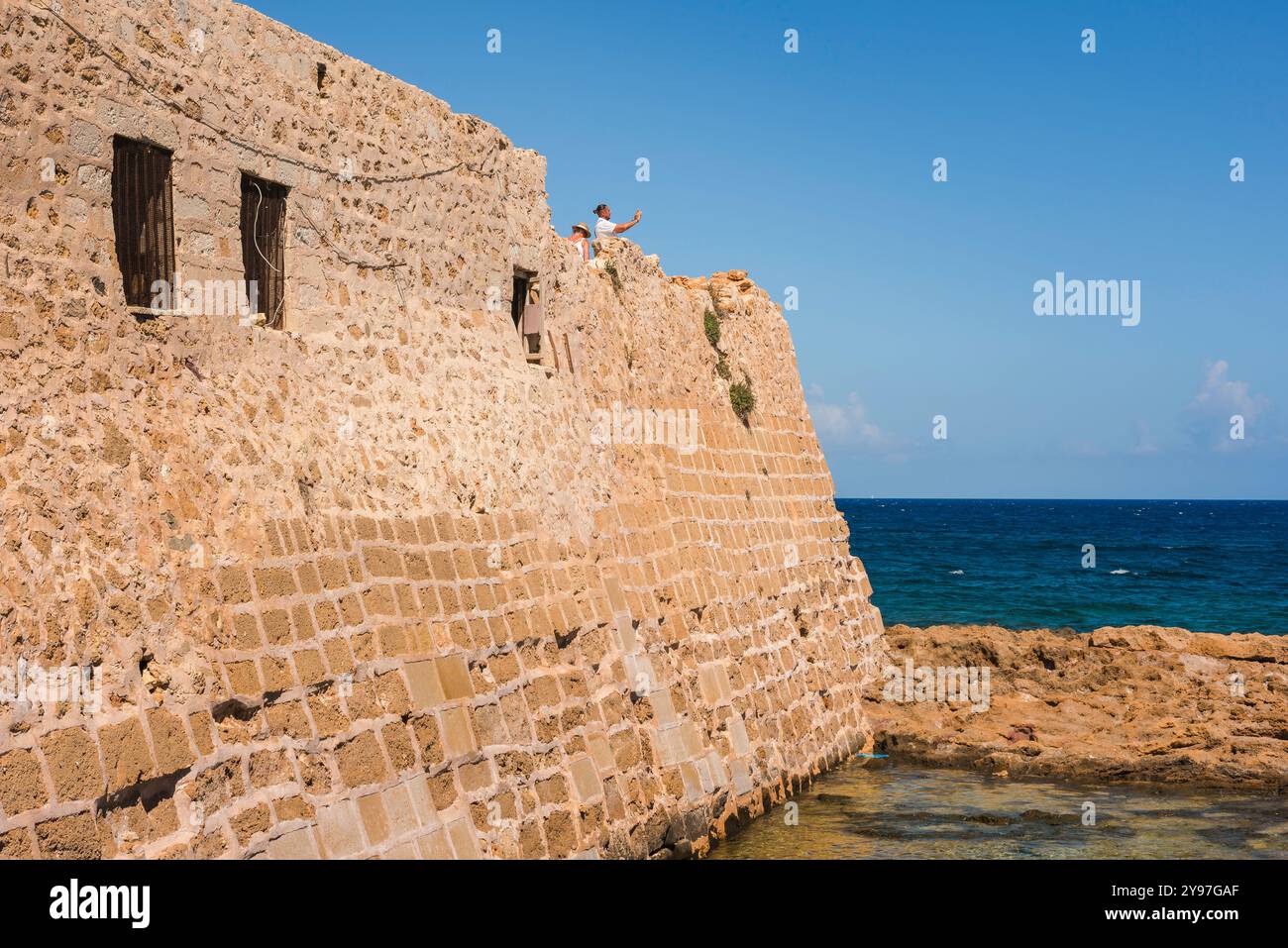 Venetian sea wall, view of tourists sightseeing on the historic sea ...