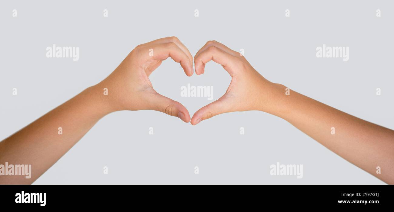 Man and woman hands making a heart shape. Female hands making sign ...