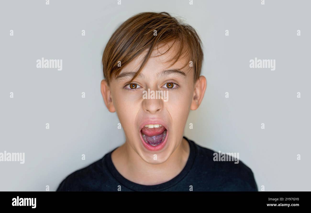 Scream. Child with angry expression. Shocked panic kid boy, screaming ...