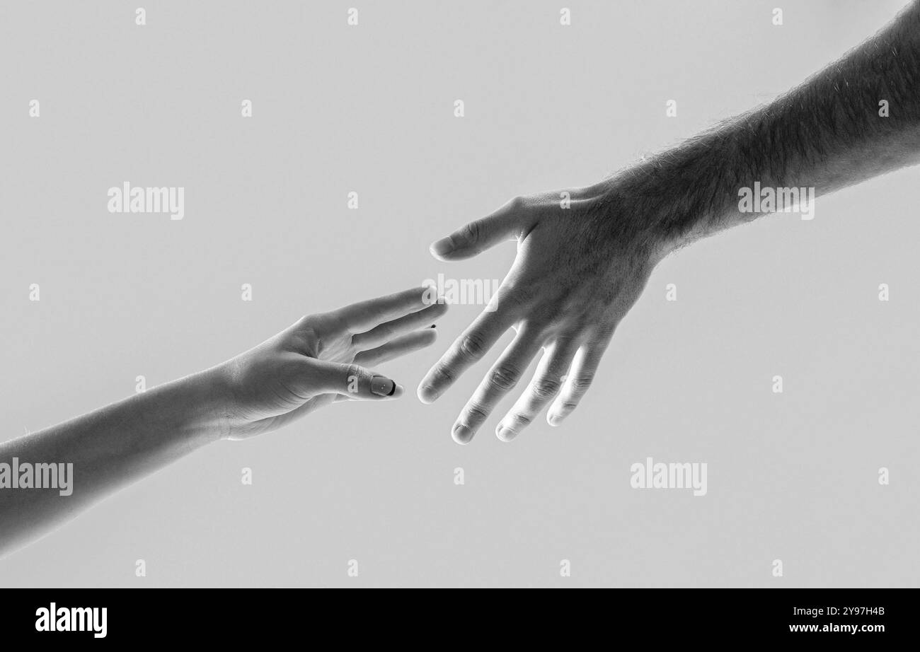 Helping hand concept, support. Two hands, shaking hands. Black and ...