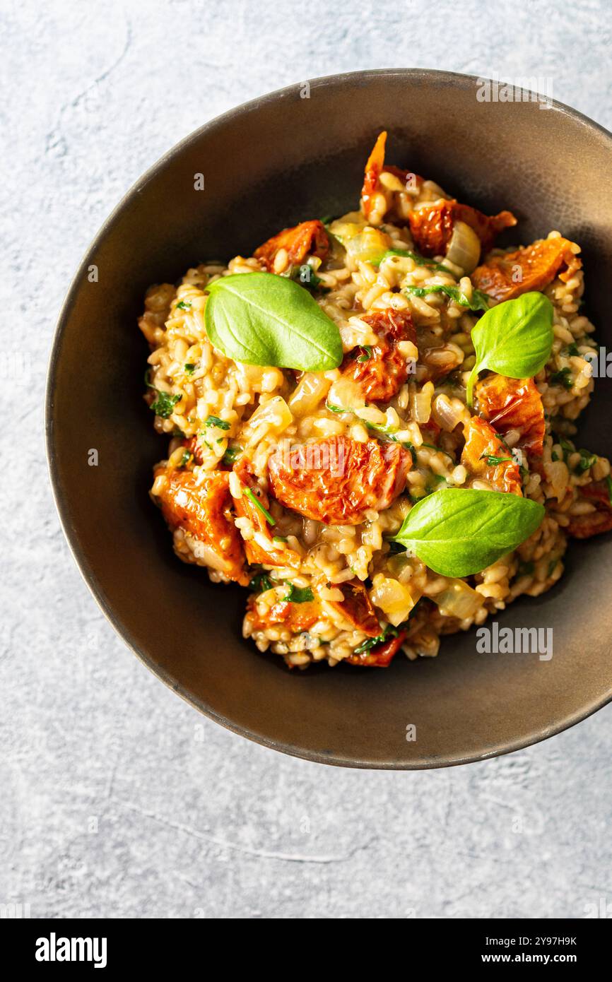 Sun-dried tomato risotto with basil Stock Photo - Alamy