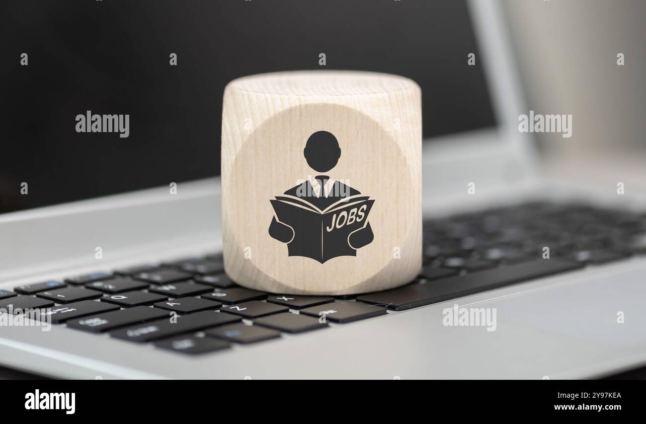Wooden block with symbol of job search concept on laptop keyboard Stock ...
