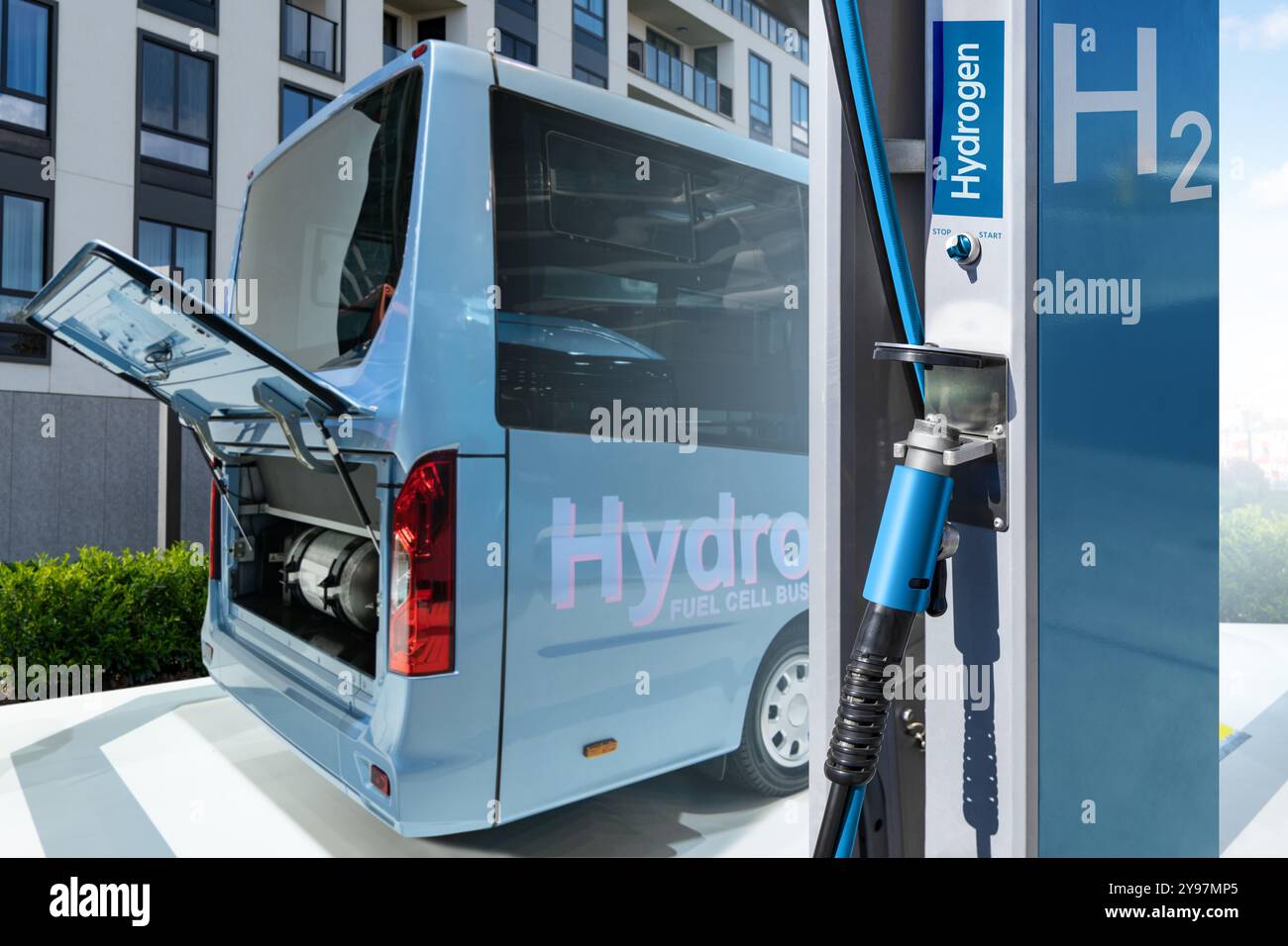 Hydrogen gas station and bus with an open hood and a hydrogen cylinder ...
