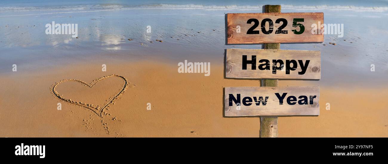 2025 happy new ye&r writted on a wooden signpost on a beach and heart ...