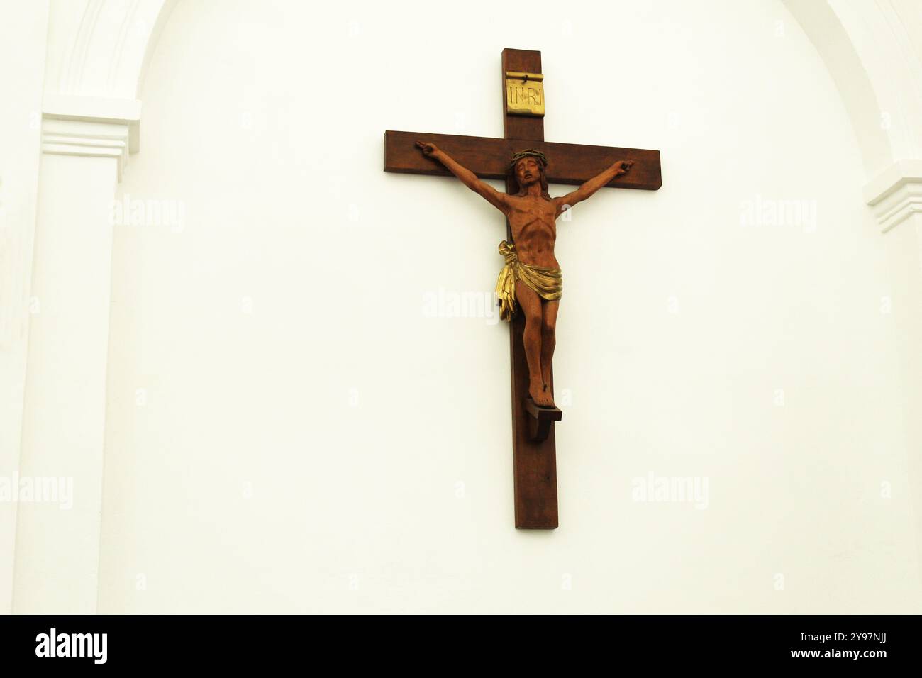 Cross with Crucifix in the church temple. Religious symbols made of ...