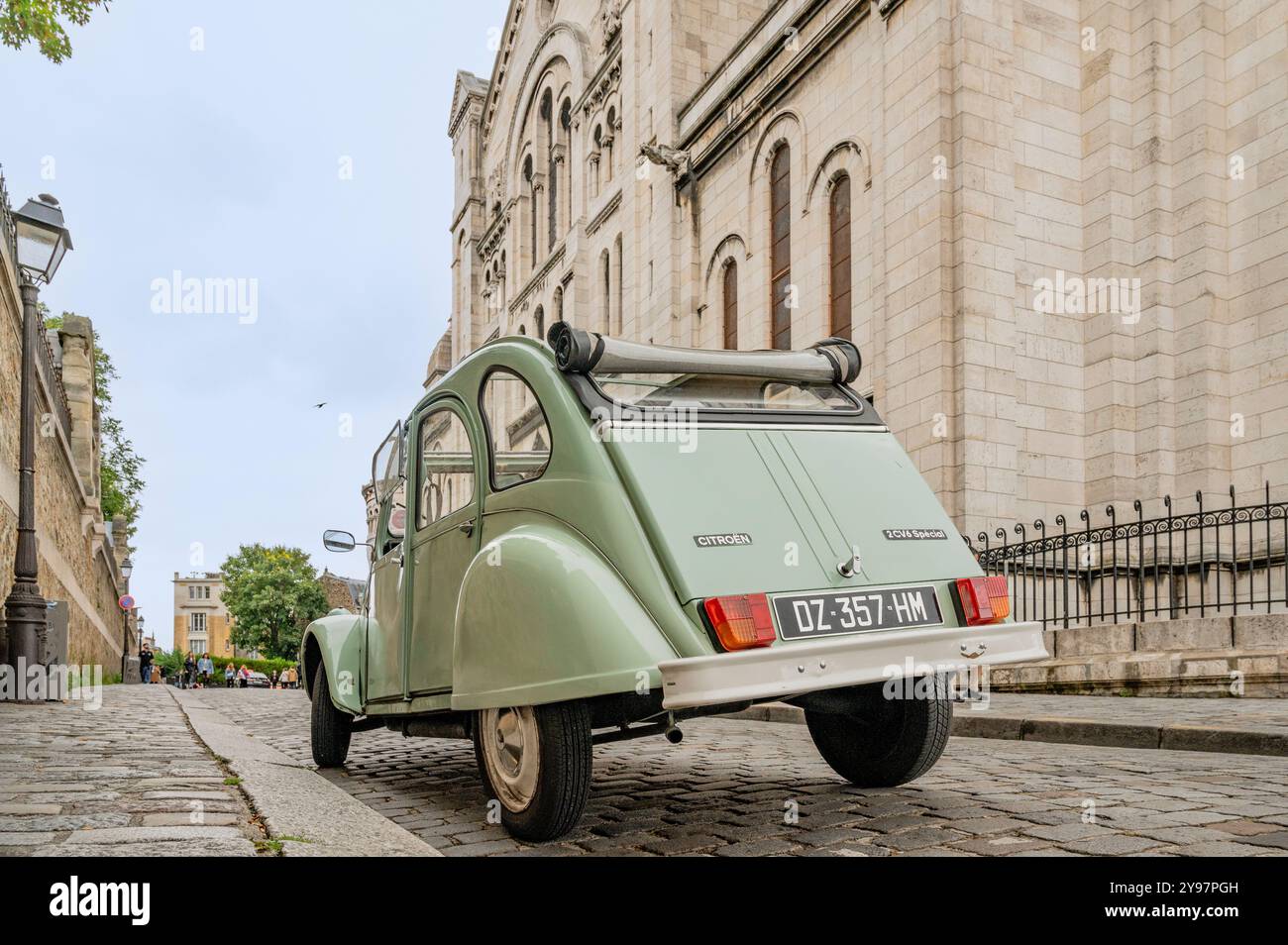 A vintage 2 CV car by Citroen parked at Montmartre next to the Sacre ...