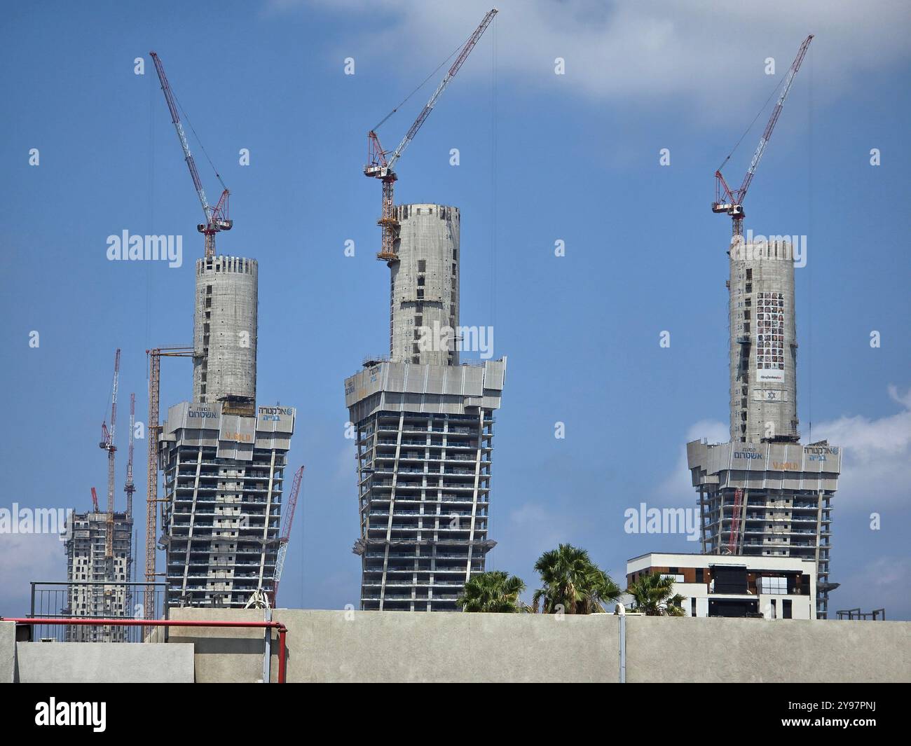 A modern urban complex with three towers under construction in Kikar ...