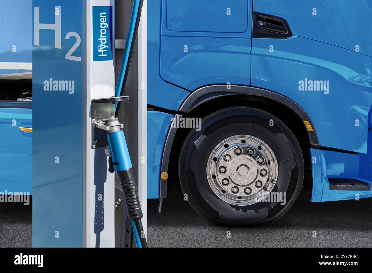 A hydrogen fuel cell semi truck with H2 gas cylinder onboard next to ...