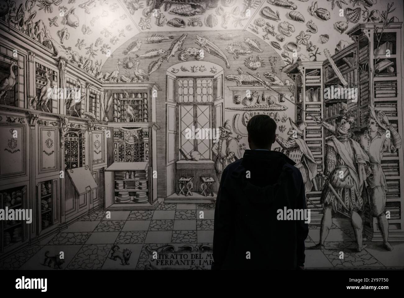 Cologne, Germany. 09th Oct, 2024. An exhibition visitor looks at the ...