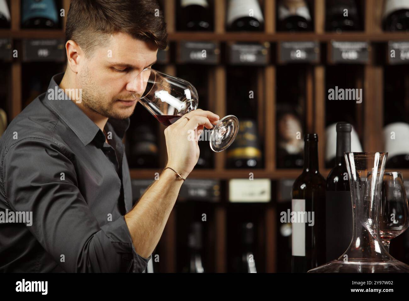 Degustation process of sommelier in wine cellar Stock Photo - Alamy
