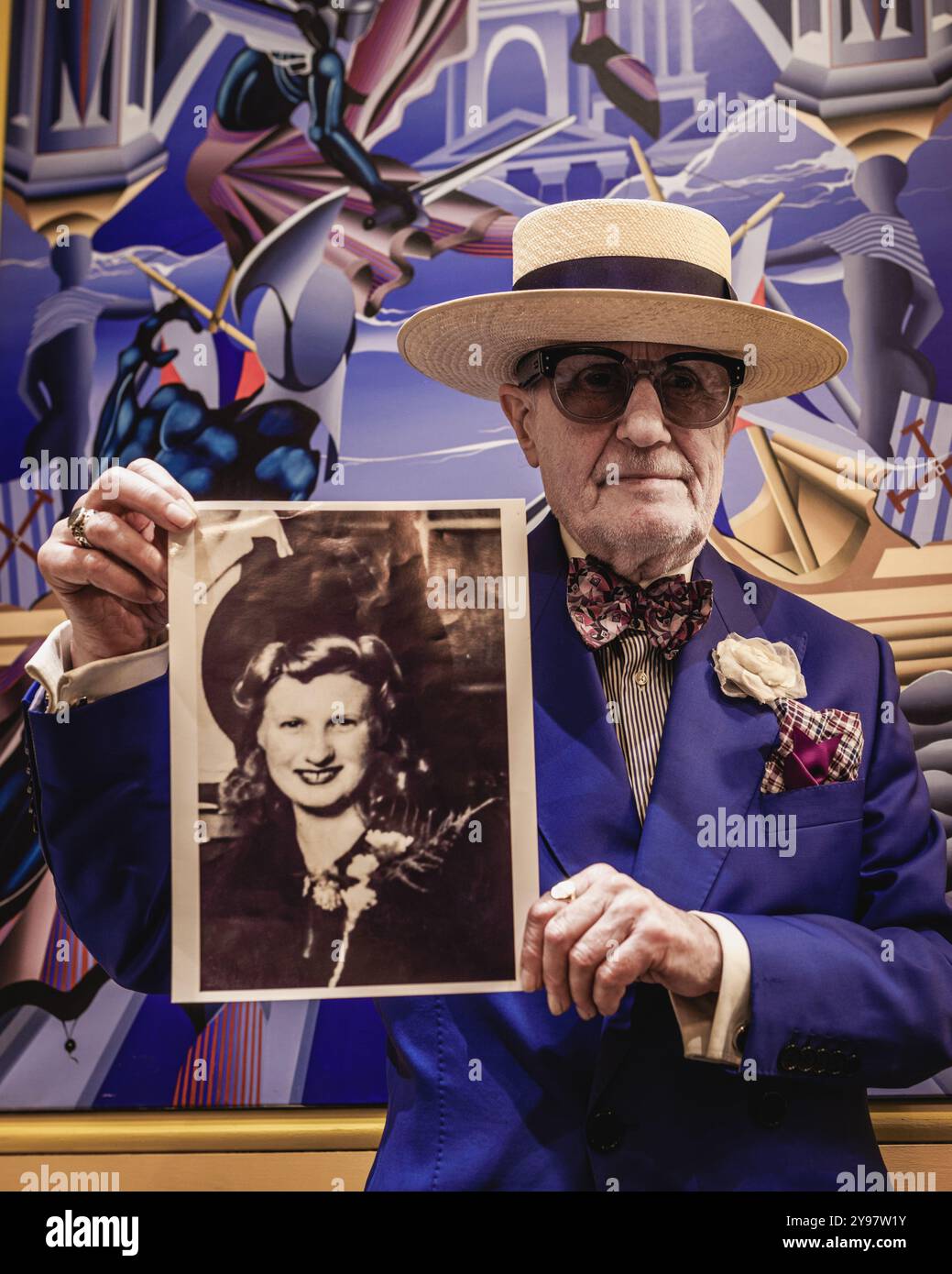 Octogenarian artist George Skeggs, also known as Soho George holds up a ...