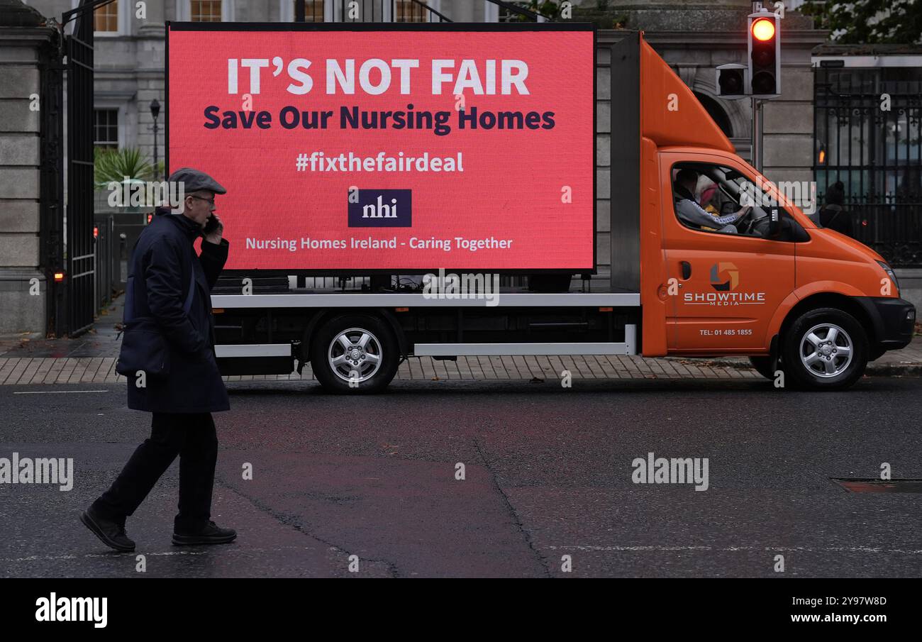 A digital billboard at Leinster House, Dublin, as Nursing Homes Ireland ...