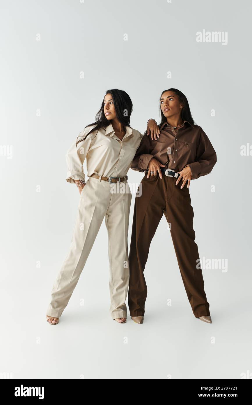 Two fashionable young women showcase trendy outfits with confidence and ...