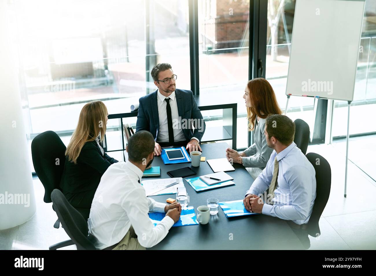 Business, architect and people with meeting in office for project ...