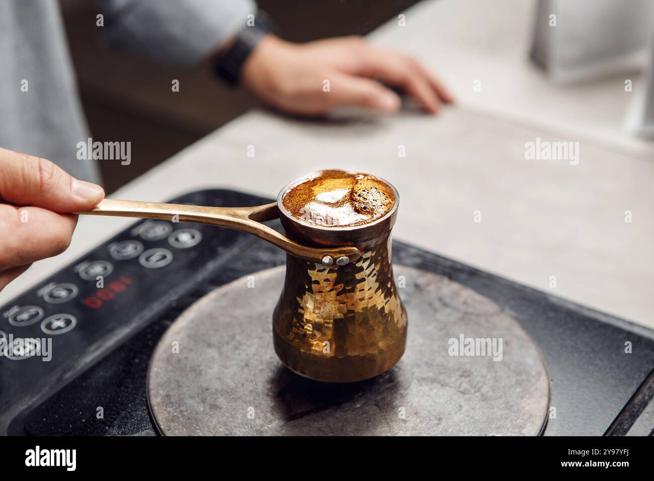 Brewing of Turkish Coffee in Traditional Heavy on Modern Stovetop Stock ...