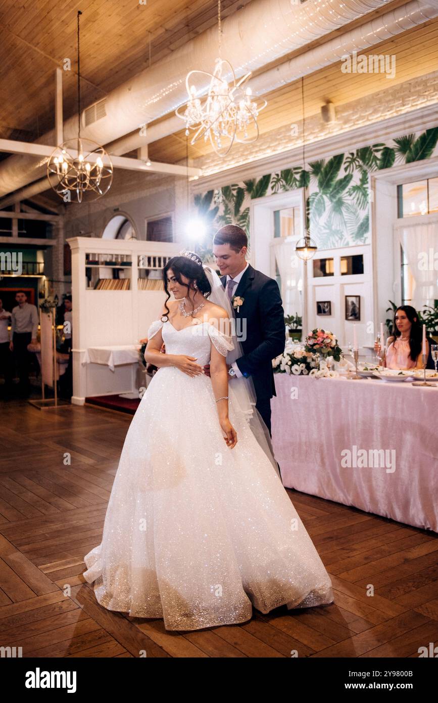 the first dance of the bride and groom inside a restaurant Stock Photo ...