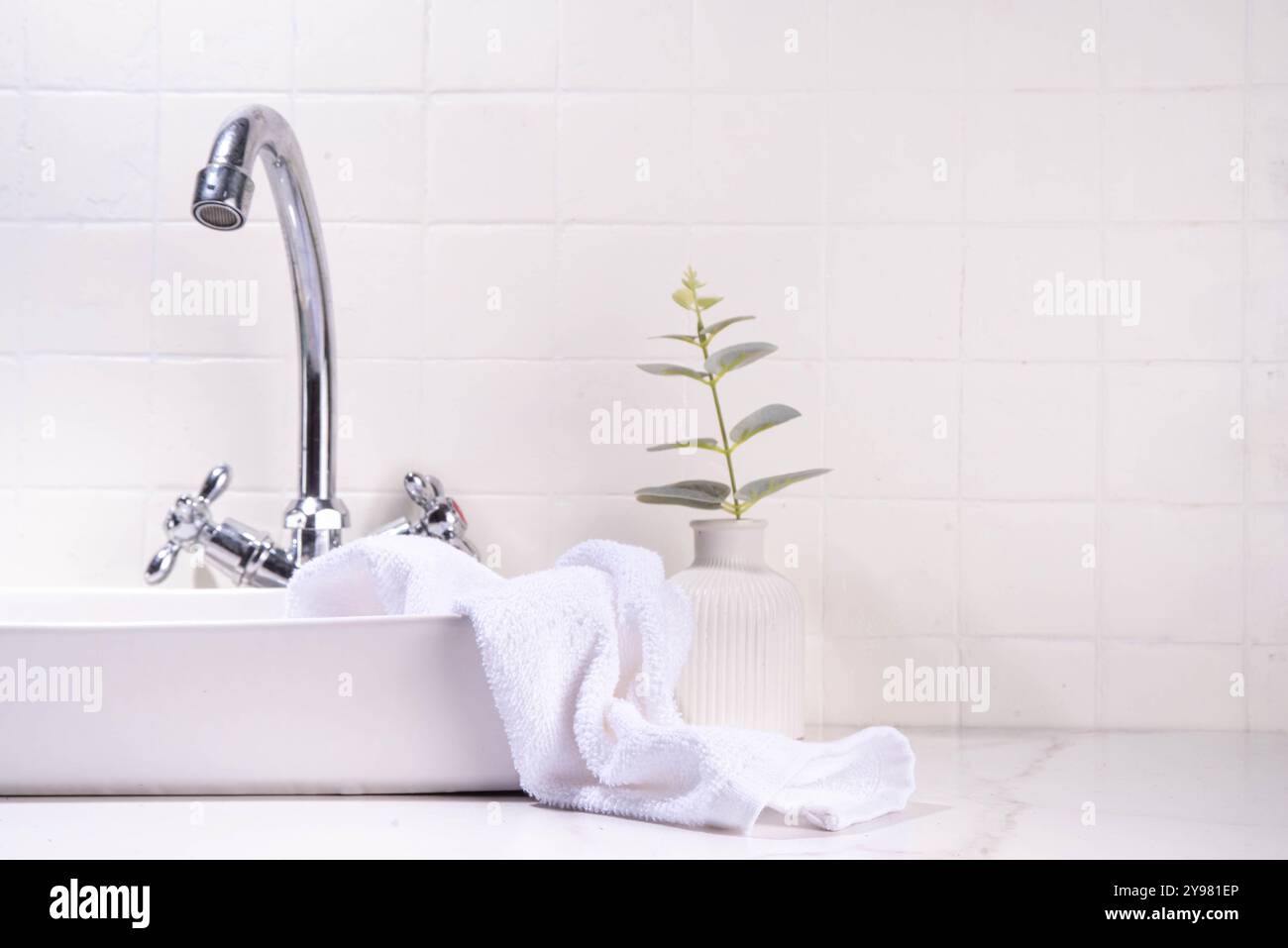 Bathroom background with sink and faucet, with textile washcloth. White ...